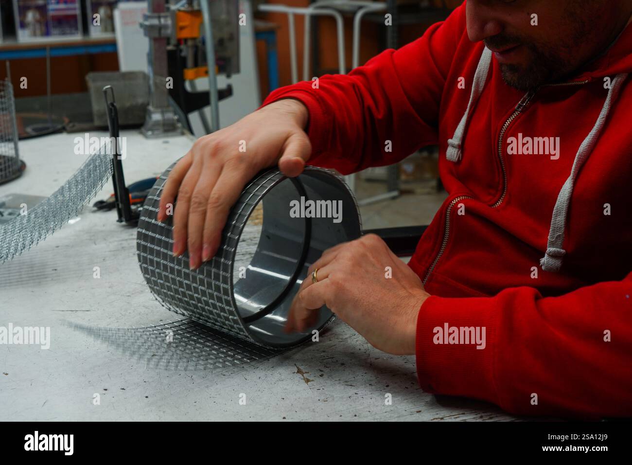 Disabled worker working in the shaping and packaging workshop. Shaping ...