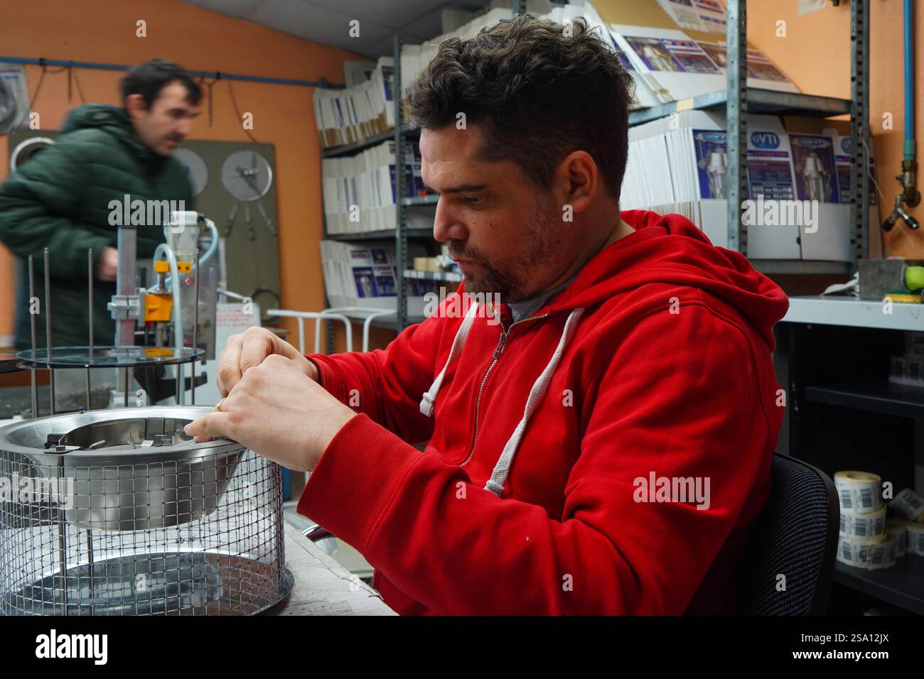 Disabled workers working in the shaping and packaging workshop ...