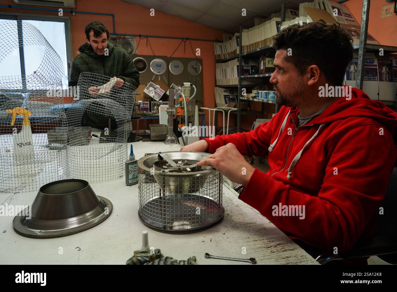 Disabled workers working in the shaping and packaging workshop ...