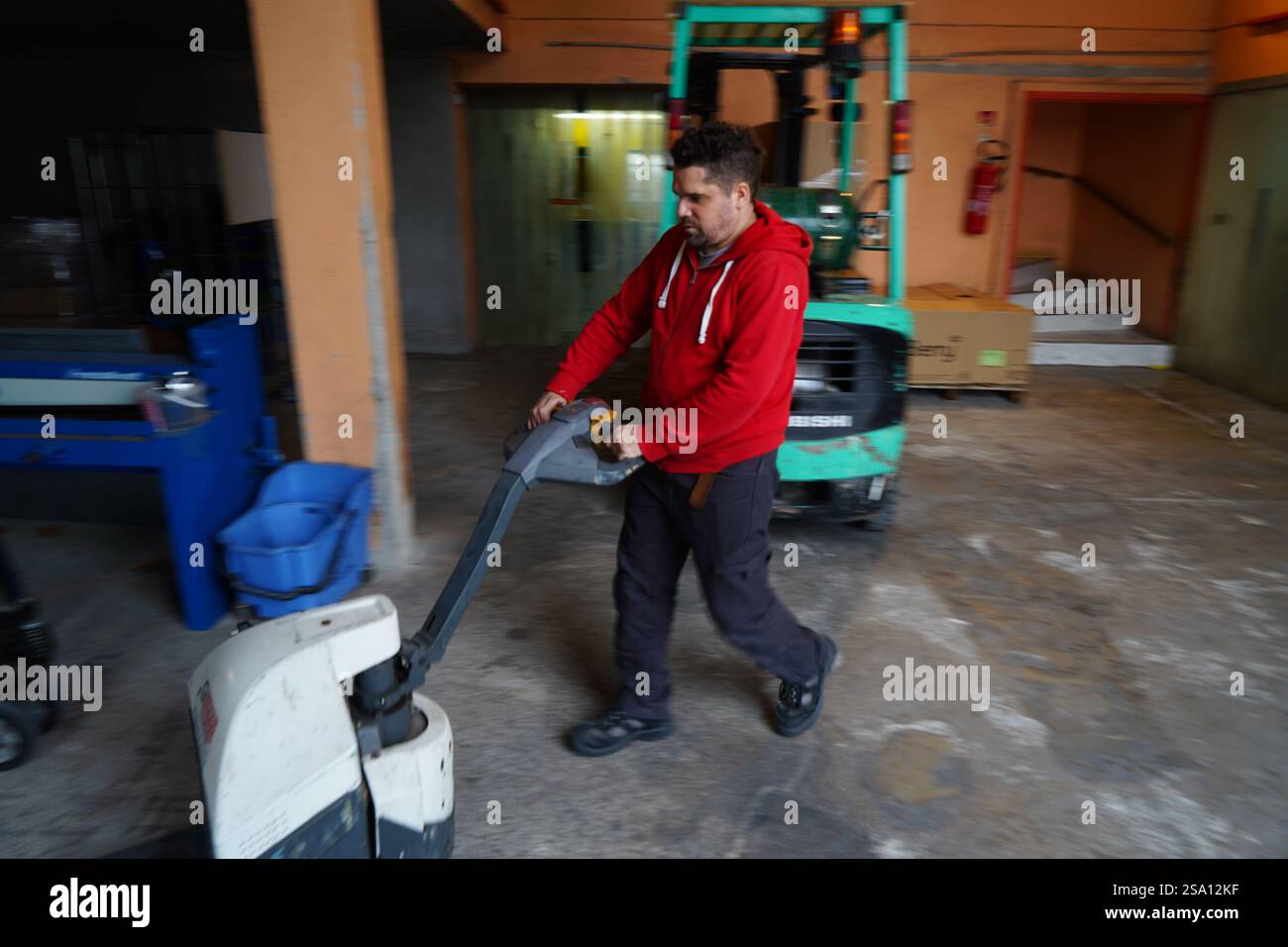 Disabled worker working in the shaping and packaging workshop ...