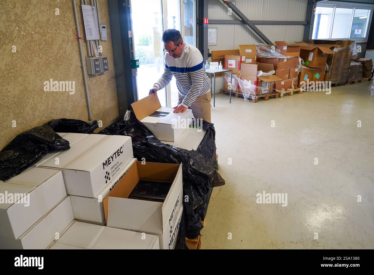 Disabled worker working in the ESAT product packaging workshop Stock ...