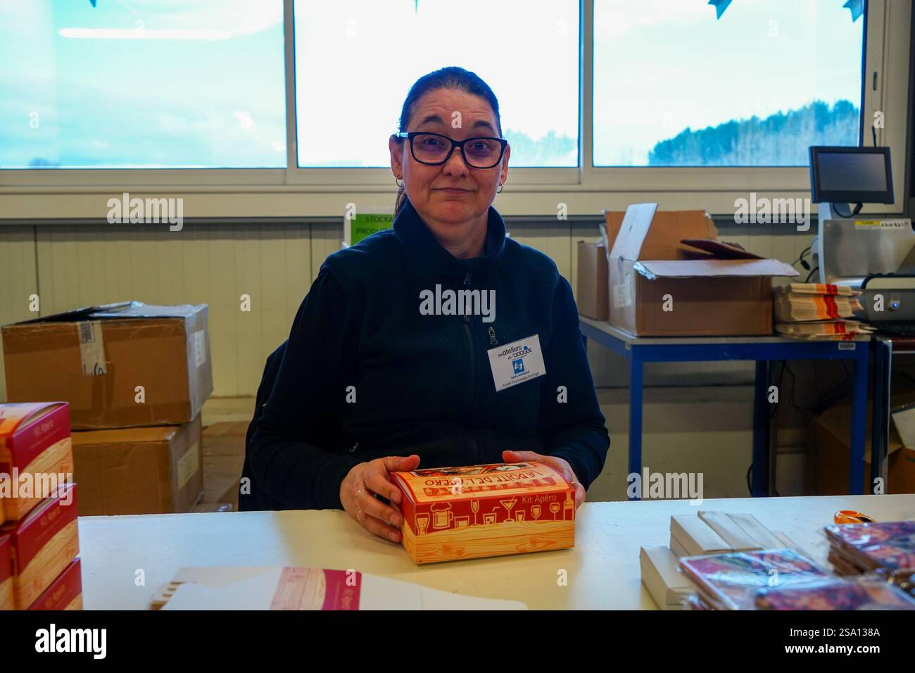 Disabled worker working in the ESAT product packaging workshop ...