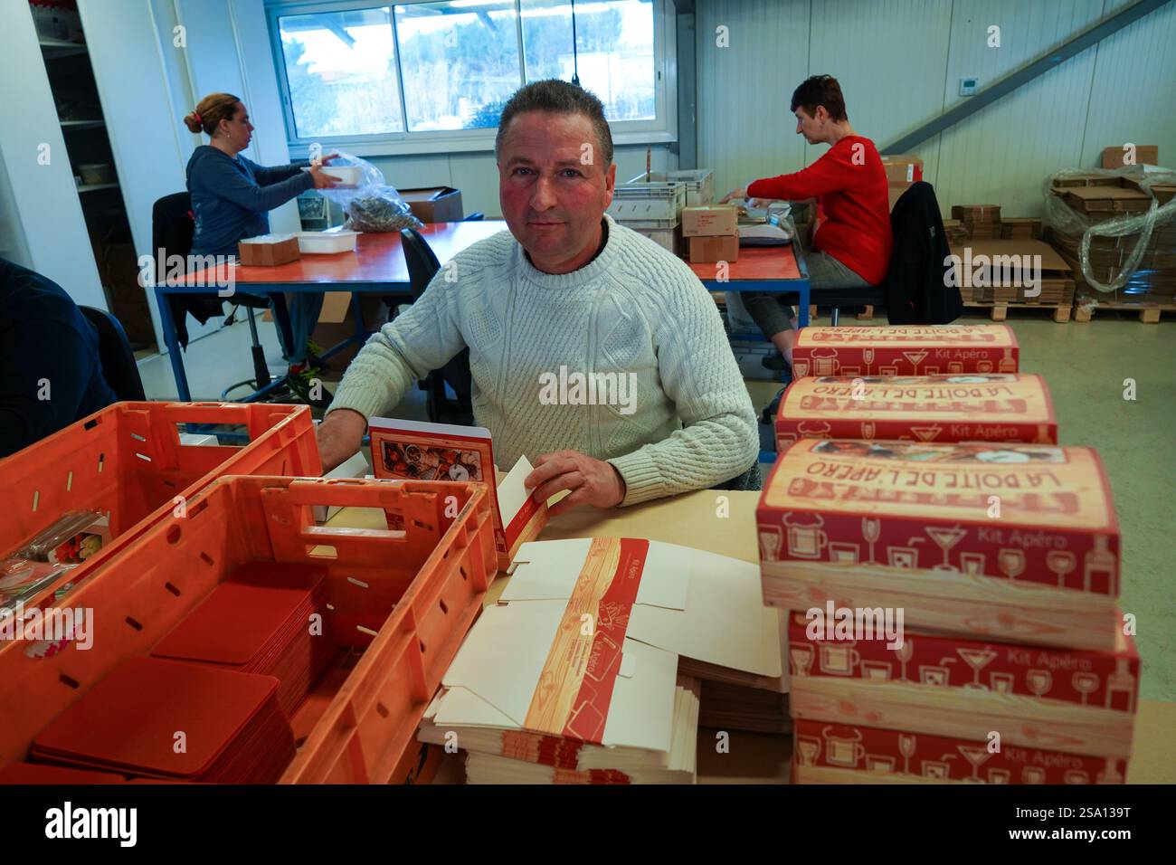 Disabled worker working in the ESAT product packaging workshop ...