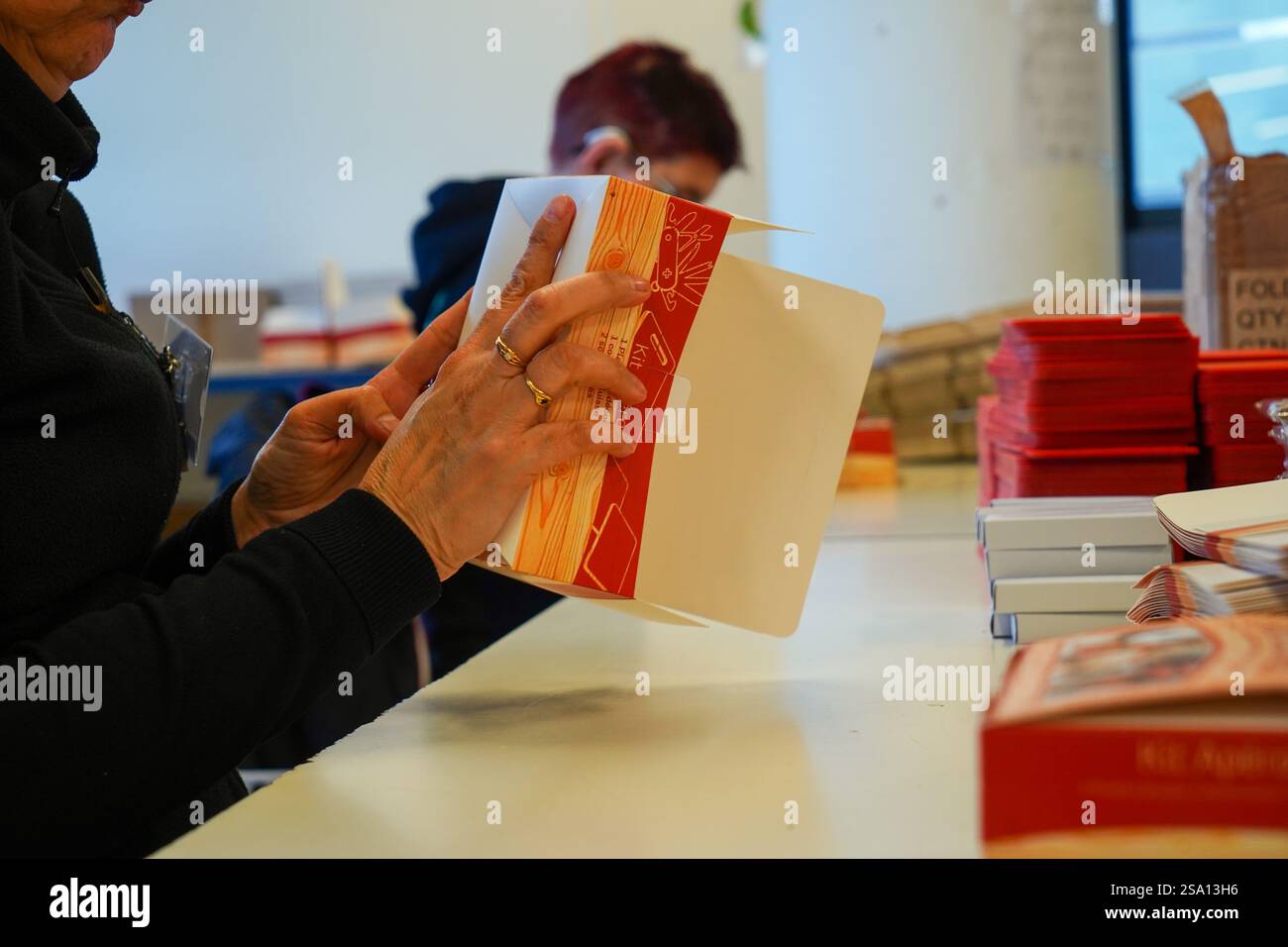 Disabled worker working in the ESAT product packaging workshop ...
