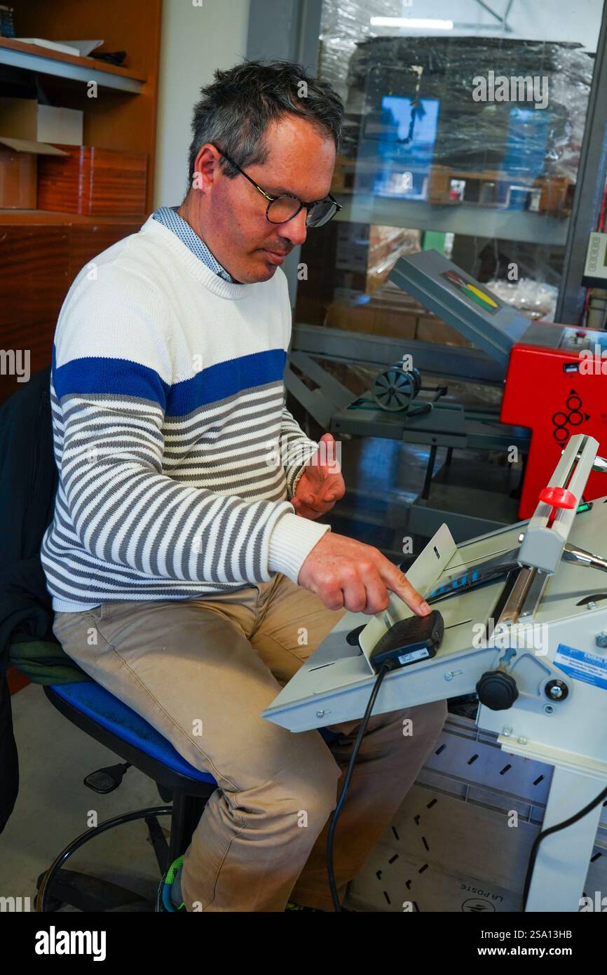 Disabled worker working in the ESAT product packaging workshop ...