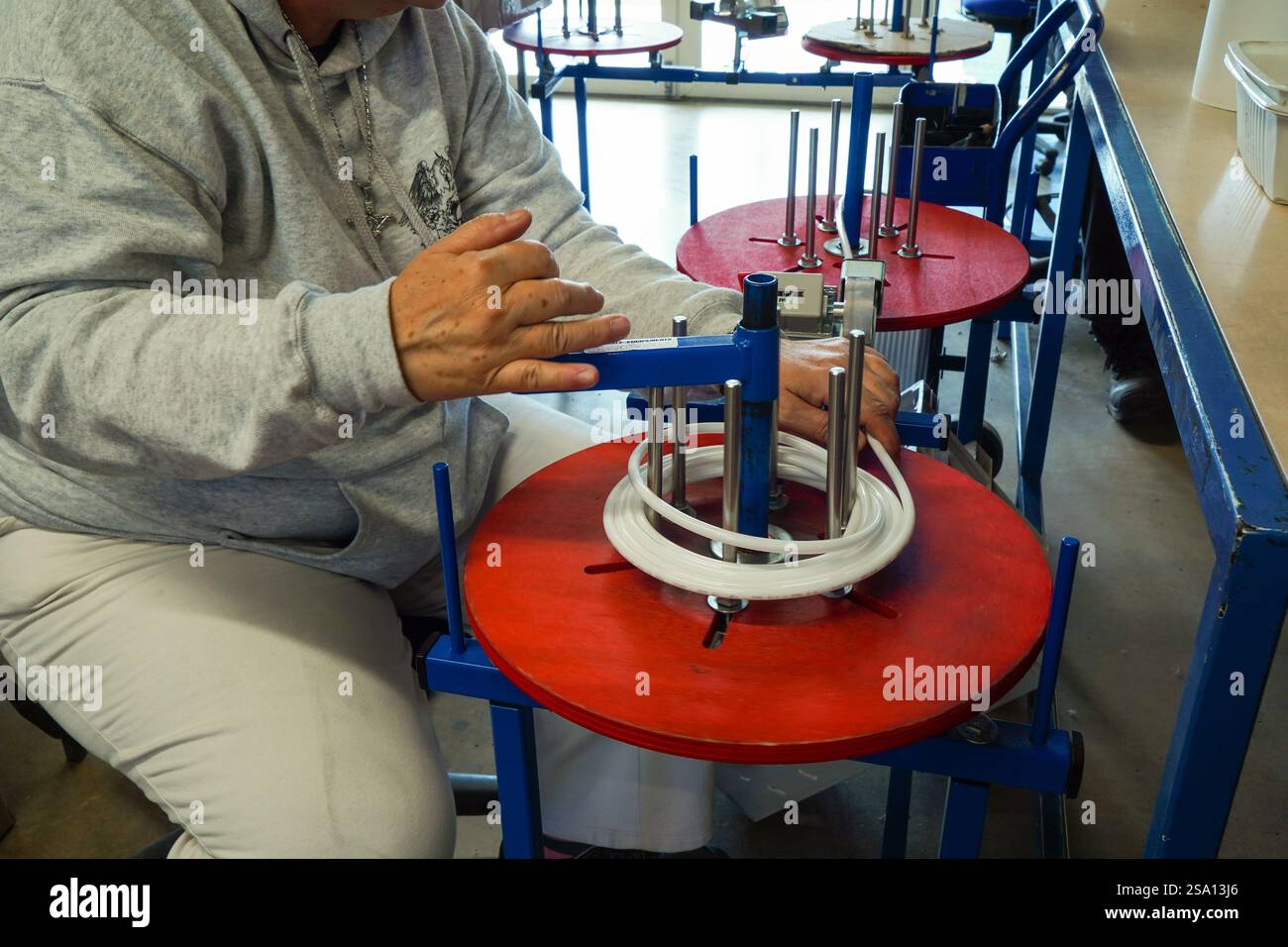 Disabled worker working in the ESAT product packaging workshop ...