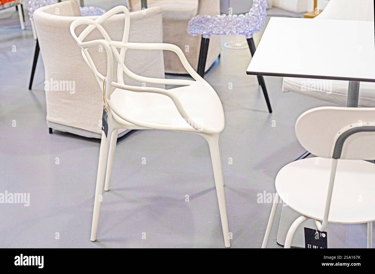 aesthetic sophisticated designer white chair in a cafe Stock Photo - Alamy