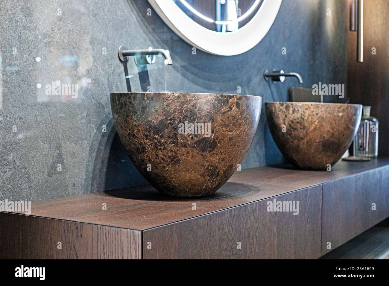 stylish bathroom with stone wash basins. Modern design Stock Photo - Alamy