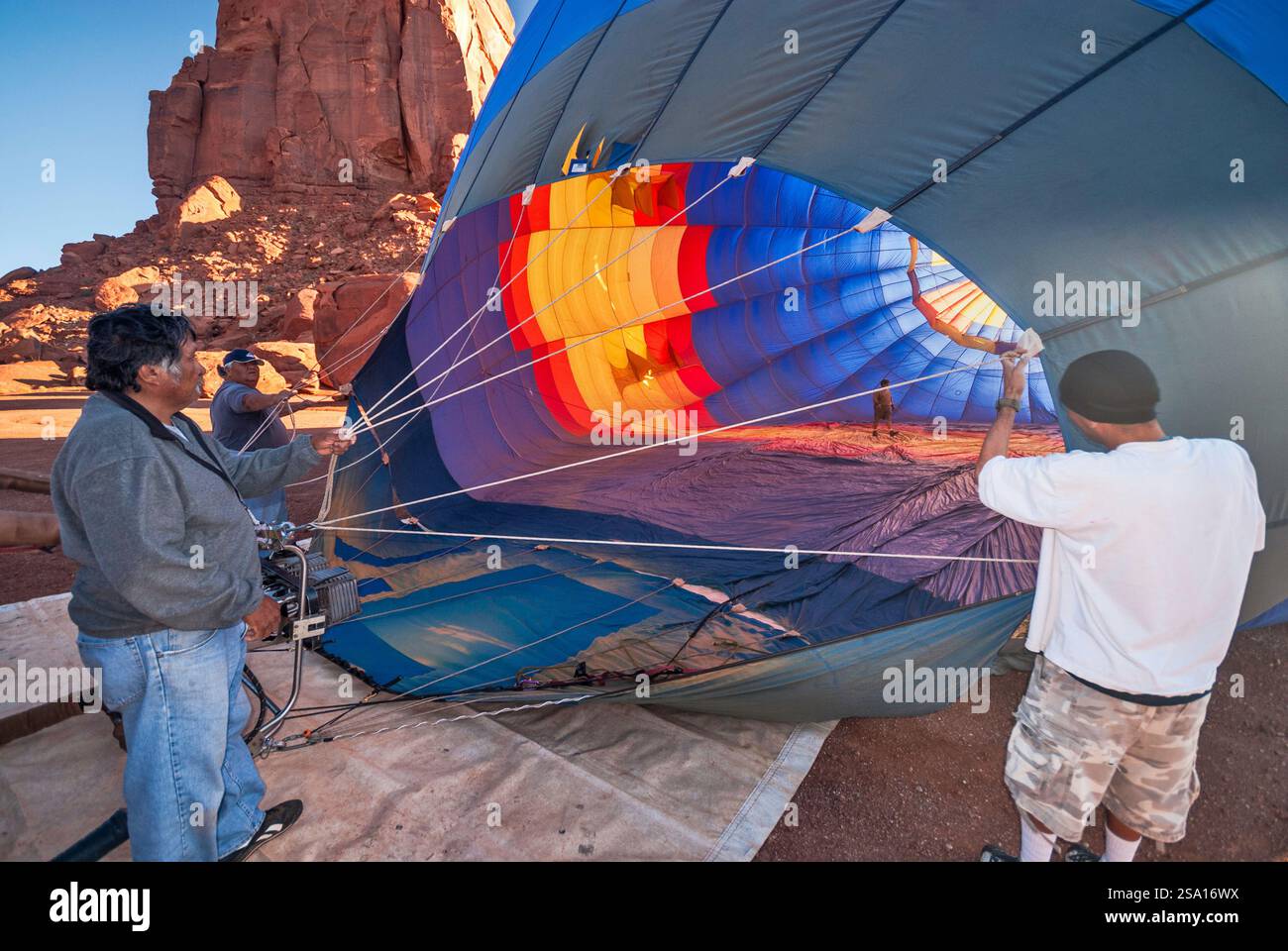Hot air balloon getting inflated before taking off near Spearhead Mesa ...