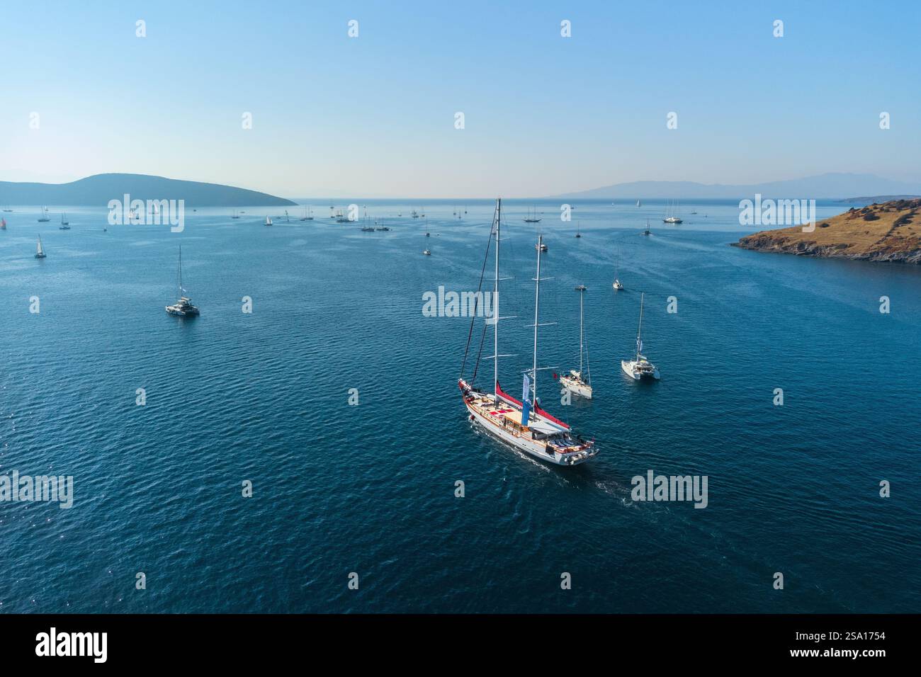 Aerial view of a white yacht crossing Bodrum Harbor, Turkey Stock Photo ...