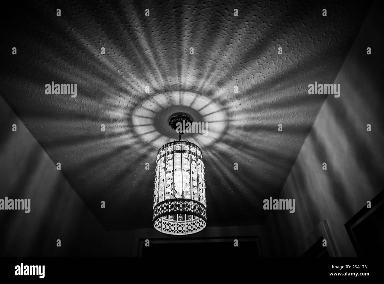 Black & white image Electric ceiling light casting shadow shapes Stock ...