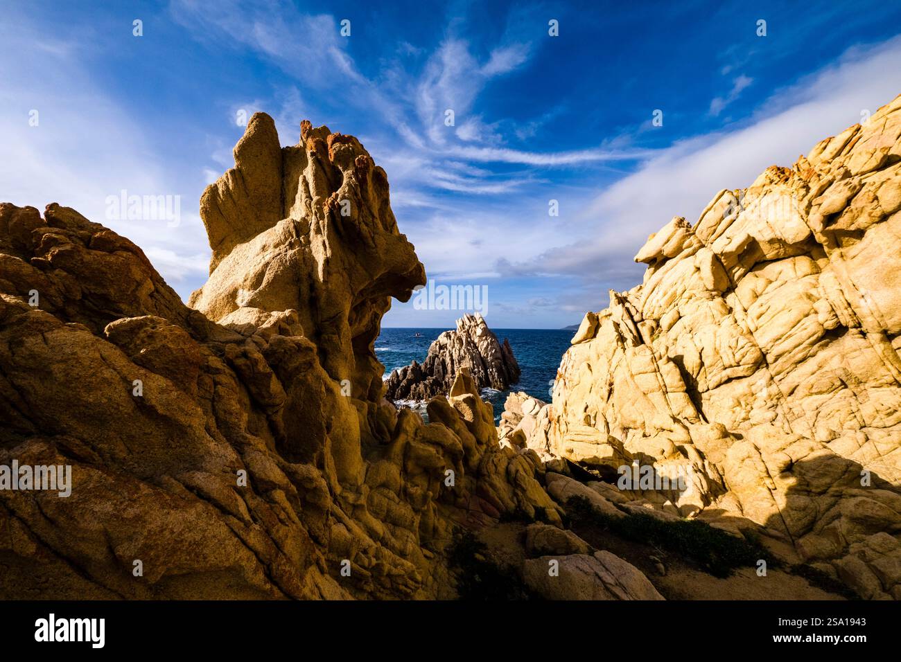 Granite rock formations on the shore near the small coastal town of ...