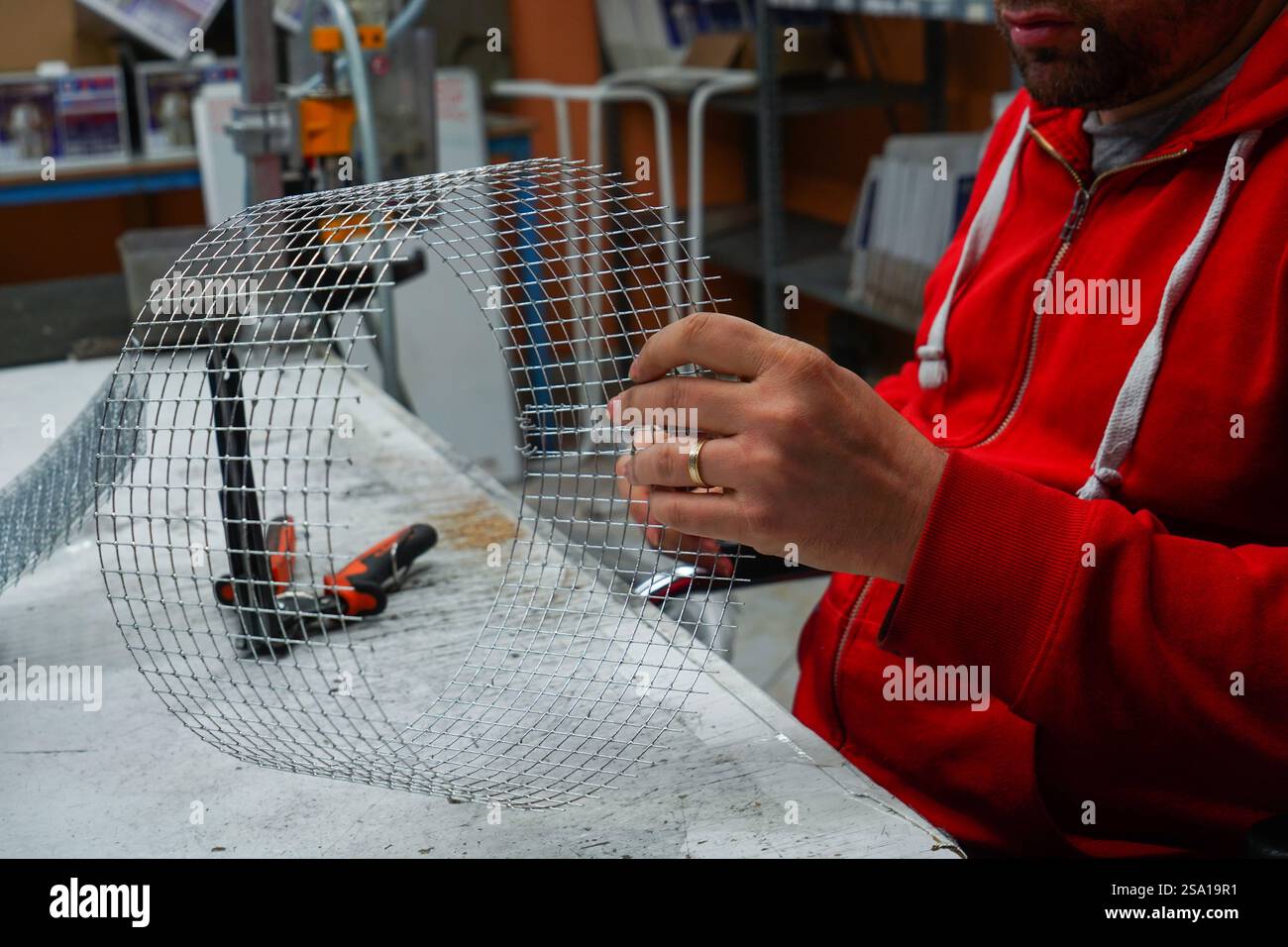 Disabled worker working in the shaping and packaging workshop. Shaping ...