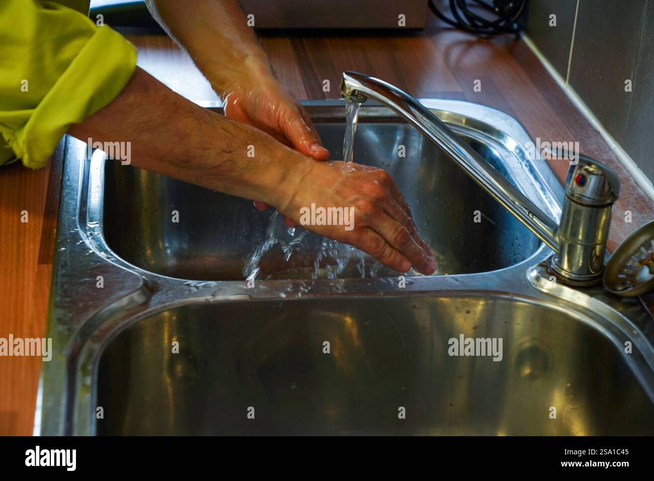 Disabled worker preparing meals for users and supervisors of the ESAT ...