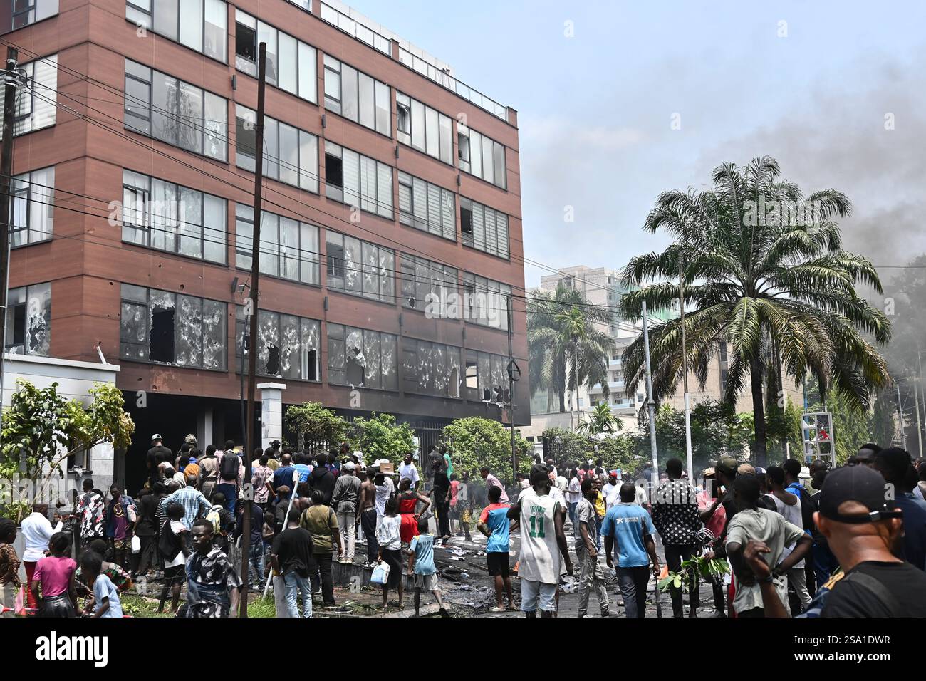 People attack the Rwanda Embassy in Kinshasa, Democratic Republic of the Congo Tuesday, Jan. 28 ...