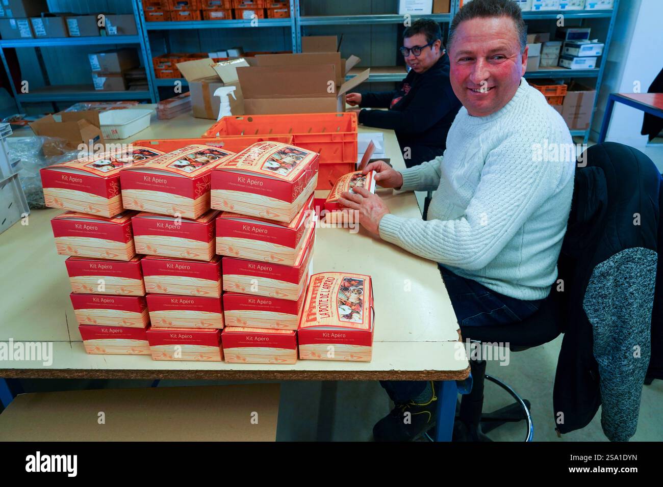 Disabled worker working in the ESAT product packaging workshop ...