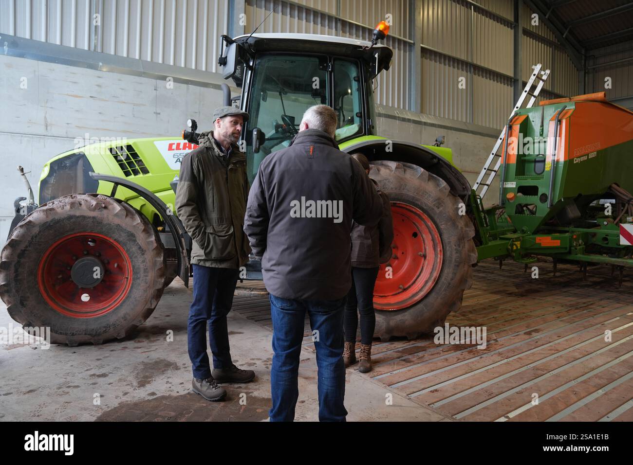 The Prince of Wales being shown a seed drill during a visit to Lower ...