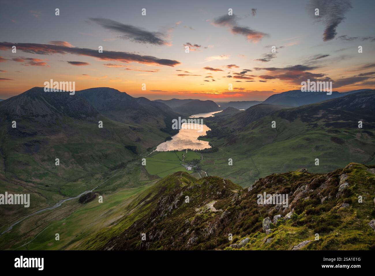 Dramatic Summer sunset seen from Fleetwith Pike overlooking Buttermere ...
