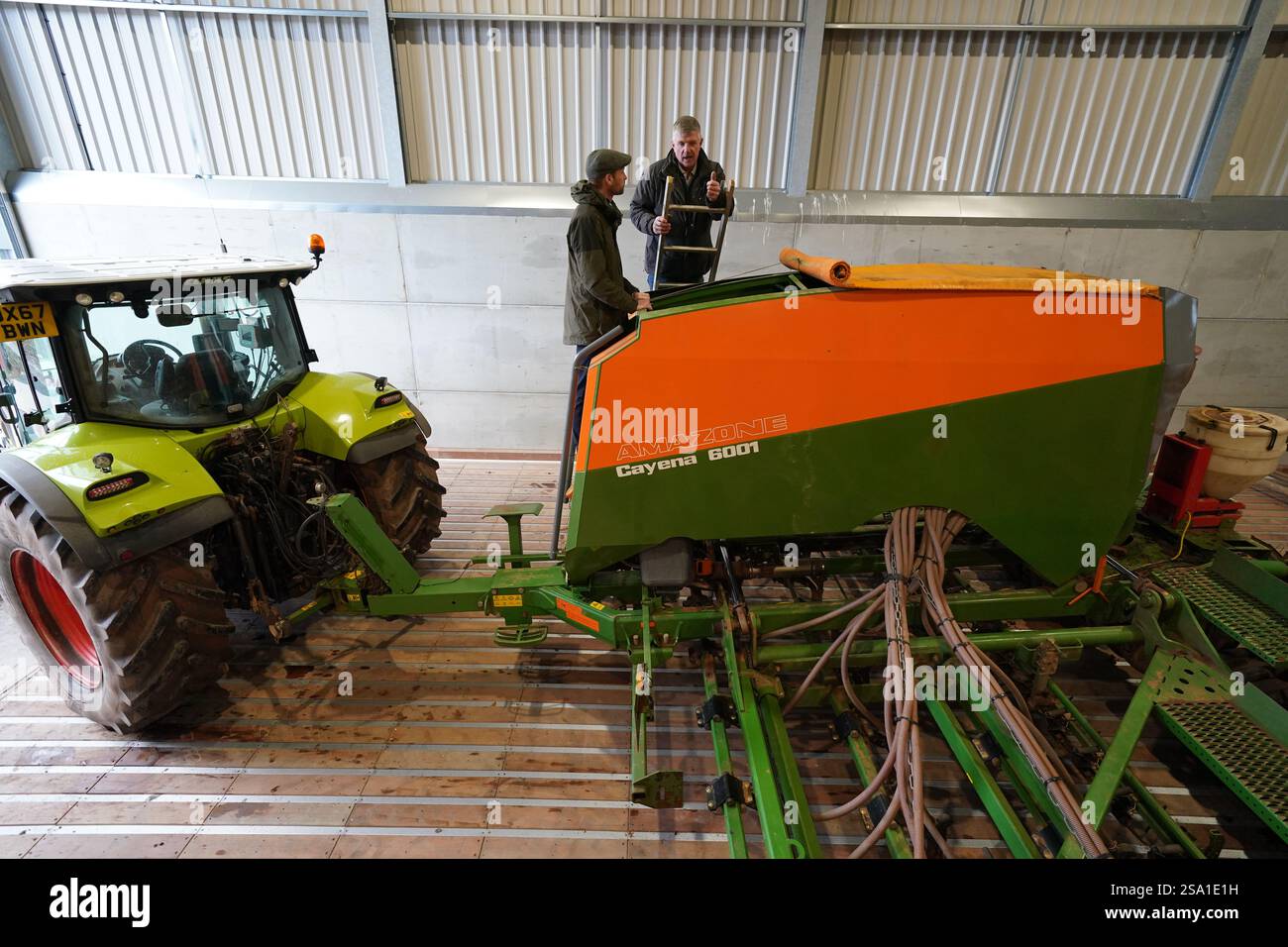 The Prince of Wales being shown a seed drill during a visit to Lower ...