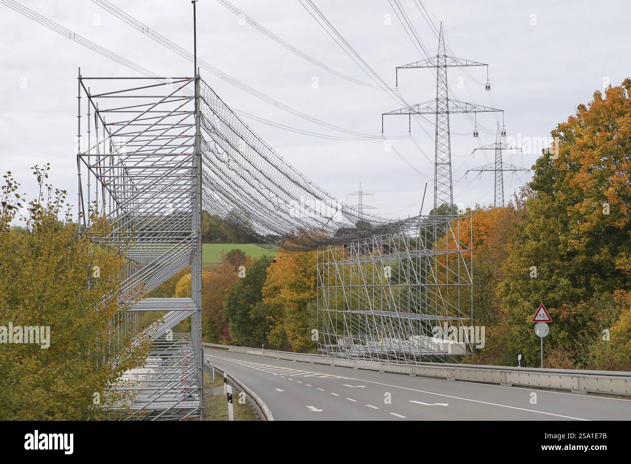 A scaffold with steel net as protection over a road, safety measure due ...