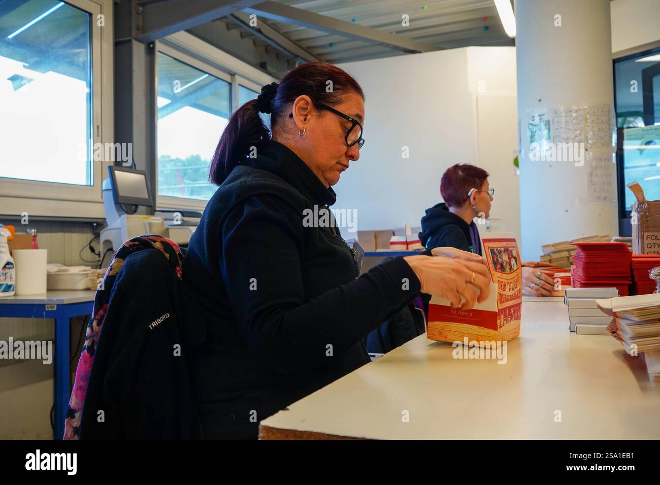 Disabled worker working in the ESAT product packaging workshop ...