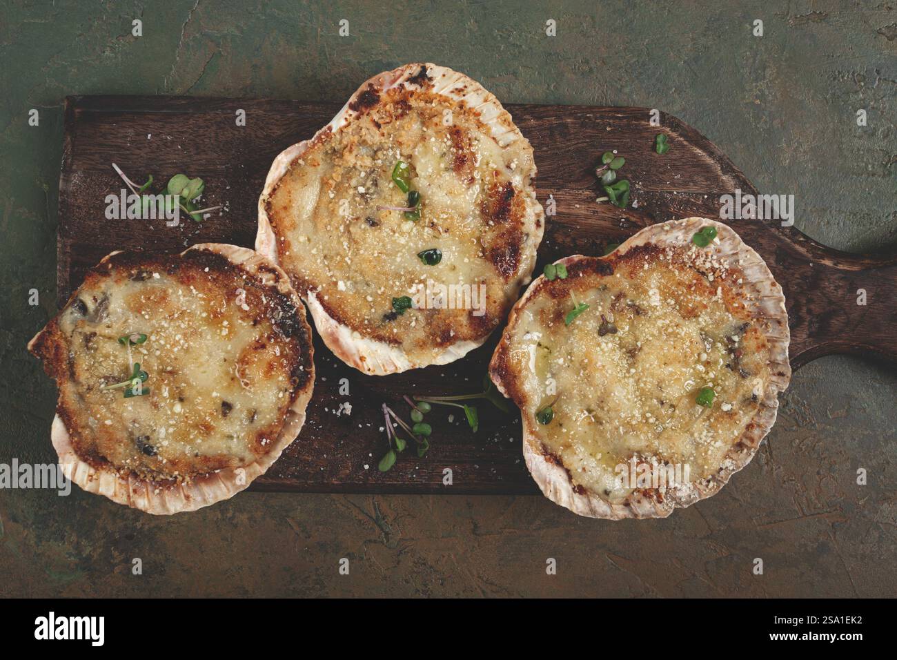 Scallop shells, stuffed, baked with cheese, in the oven, julienne with ...
