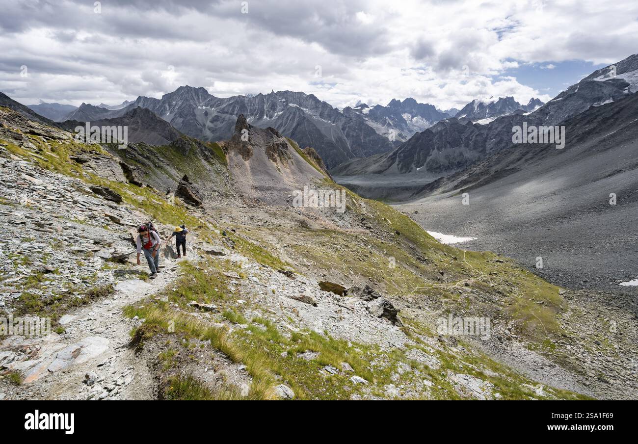 Mountaineer on a hiking trail, mountain landscape, ascent to Col de ...