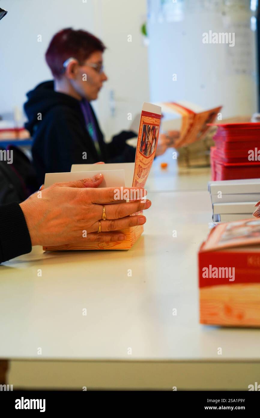 Disabled worker working in the ESAT product packaging workshop ...