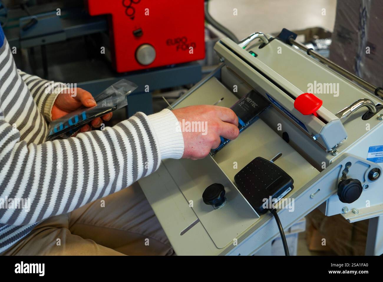 Disabled worker working in the ESAT product packaging workshop ...