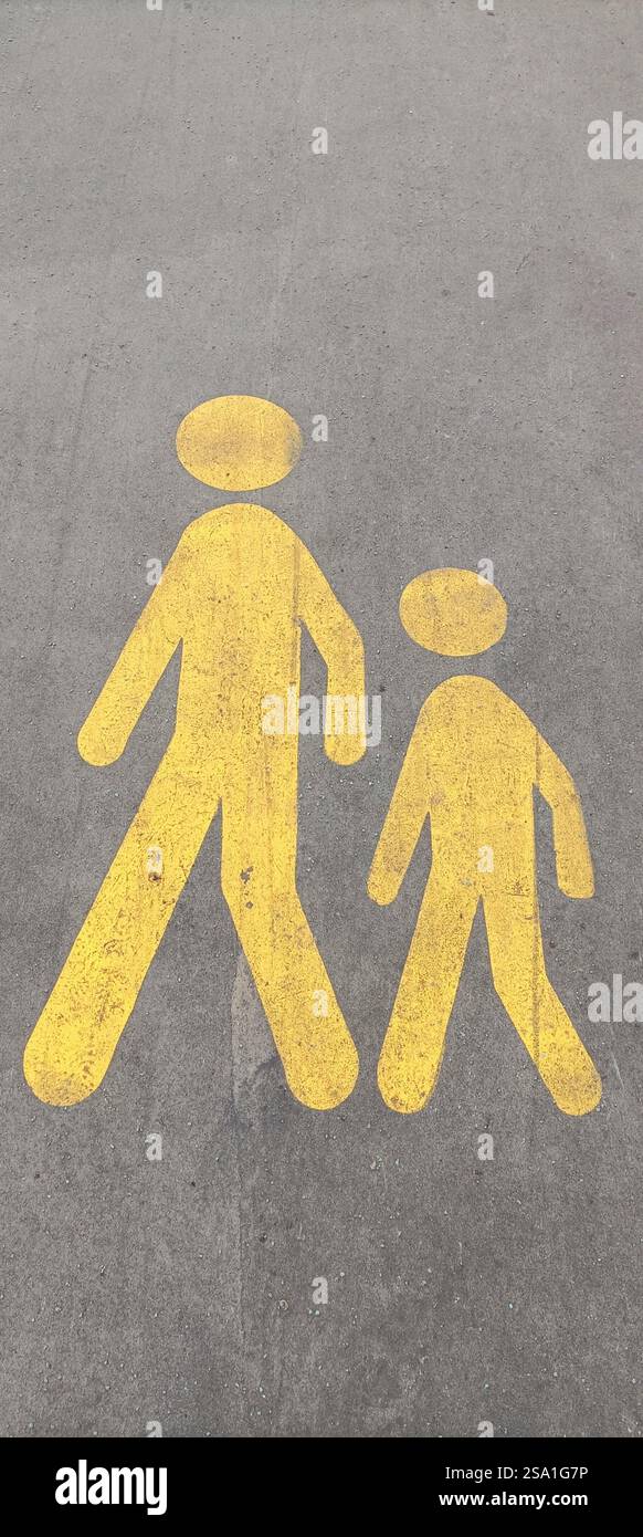 Pedestrians sign drawn on asphalt, adult and child symbols Stock Photo ...