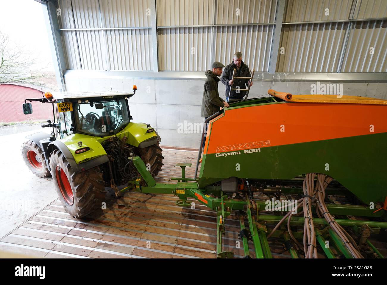 The Prince of Wales being shown a seed drill during a visit to Lower ...