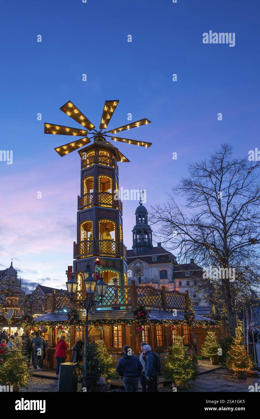 Large Christmas pyramid at the Christmas market at dusk, behind the ...