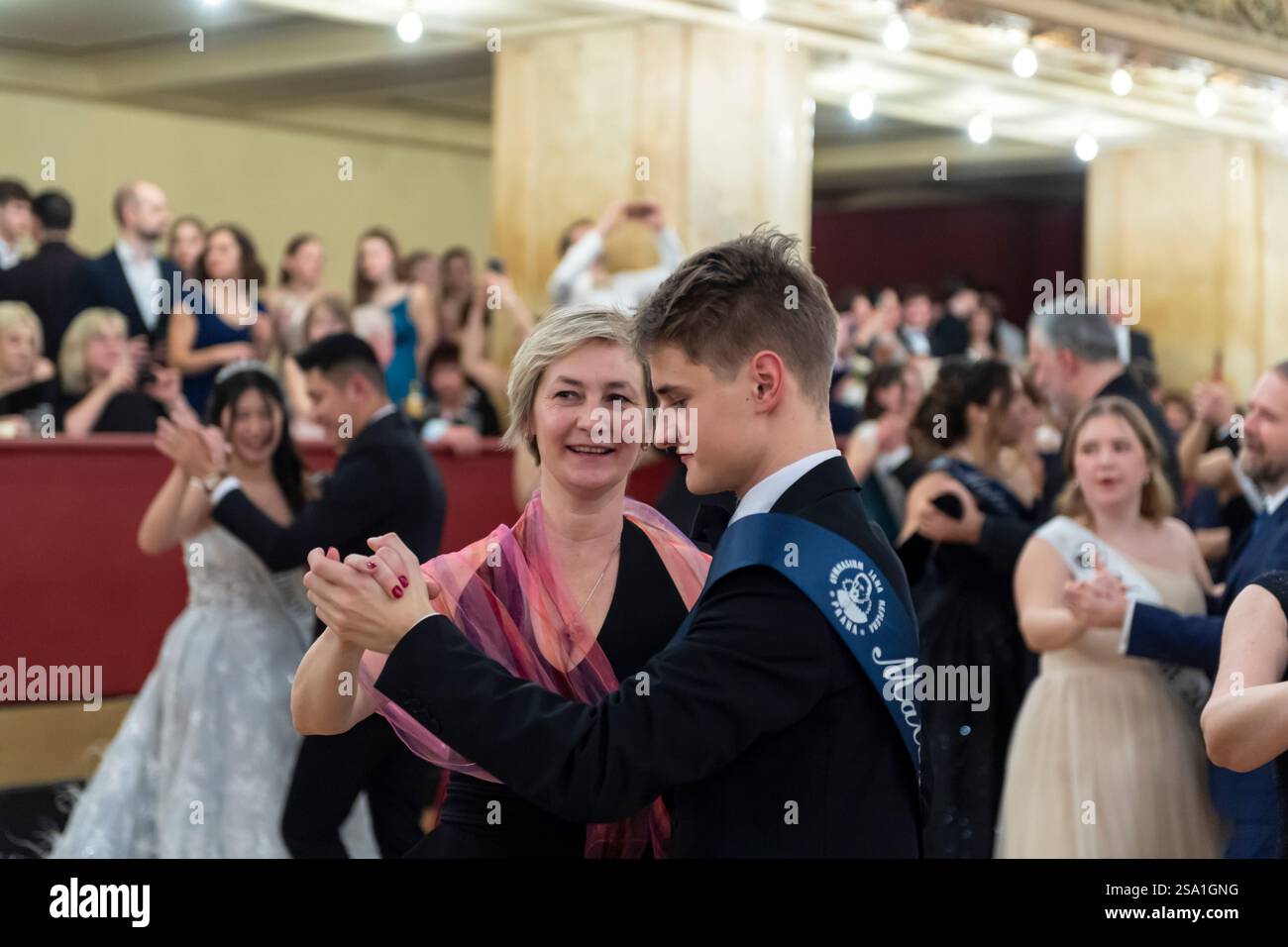 Mother dancing with son on traditional graduate ball in Prague's famous ...
