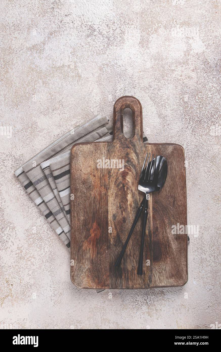 Square, wooden chopping board, chopping board with handle, on a kitchen ...