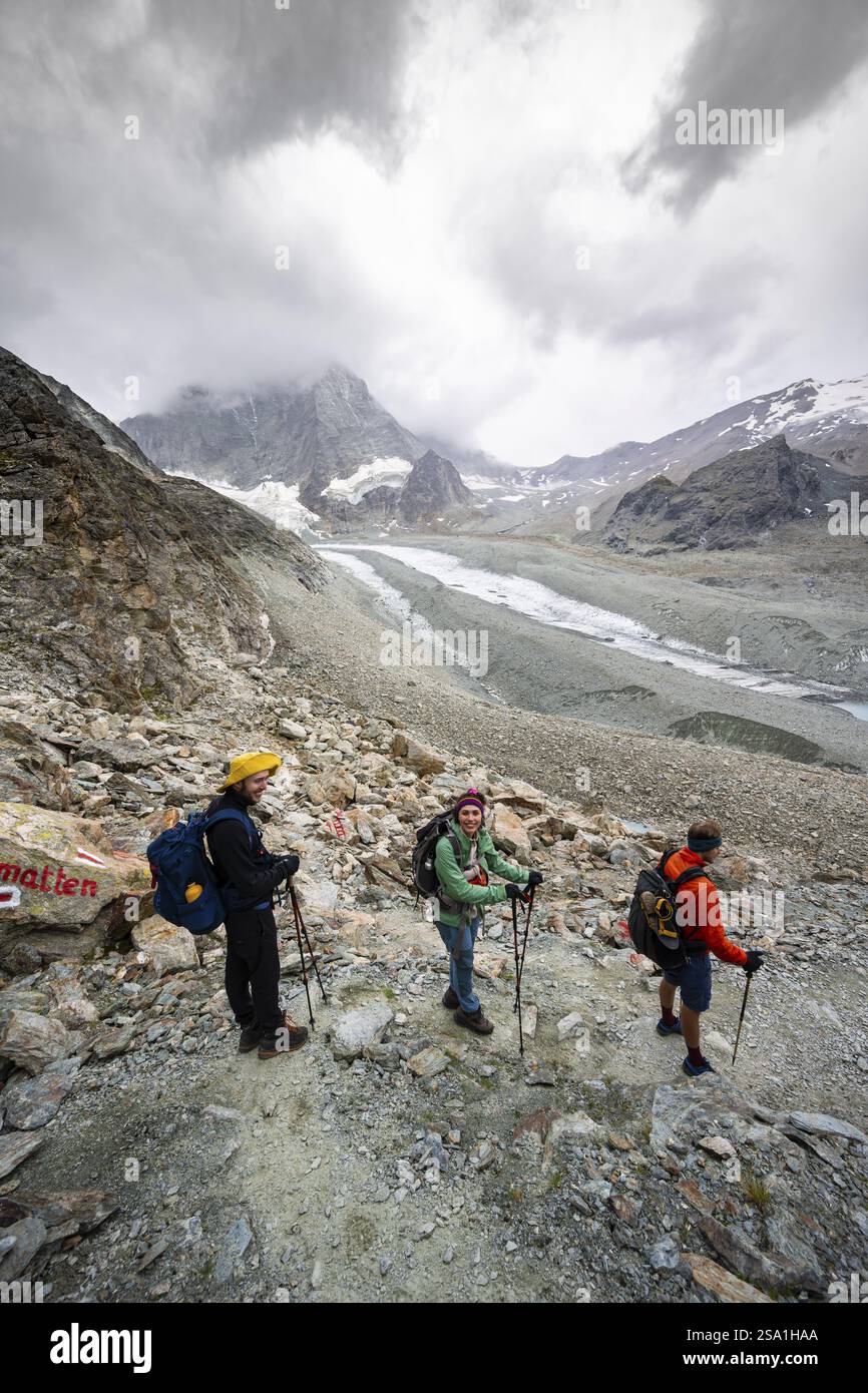 Group of mountaineers descending from Col de Riedmatten, view of ...