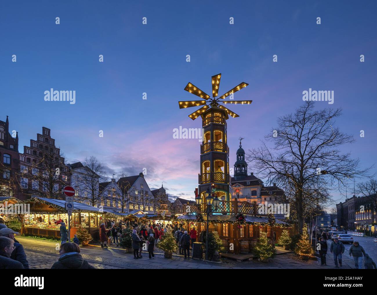 Christmas market with large Christmas pyramid at dusk, behind the ...