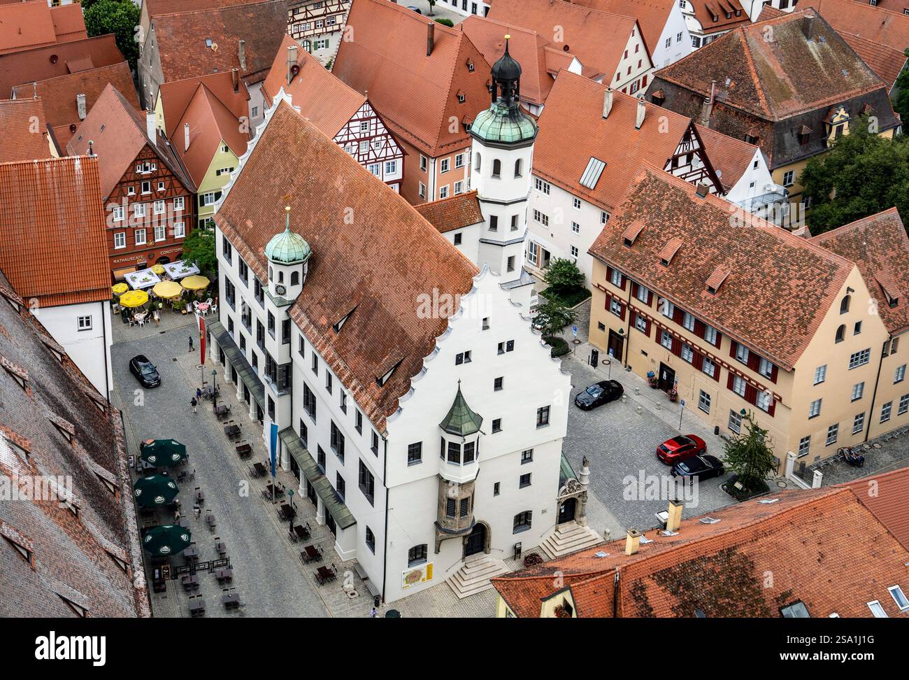 Aerial view of a historic building with a clock tower surrounded by ...