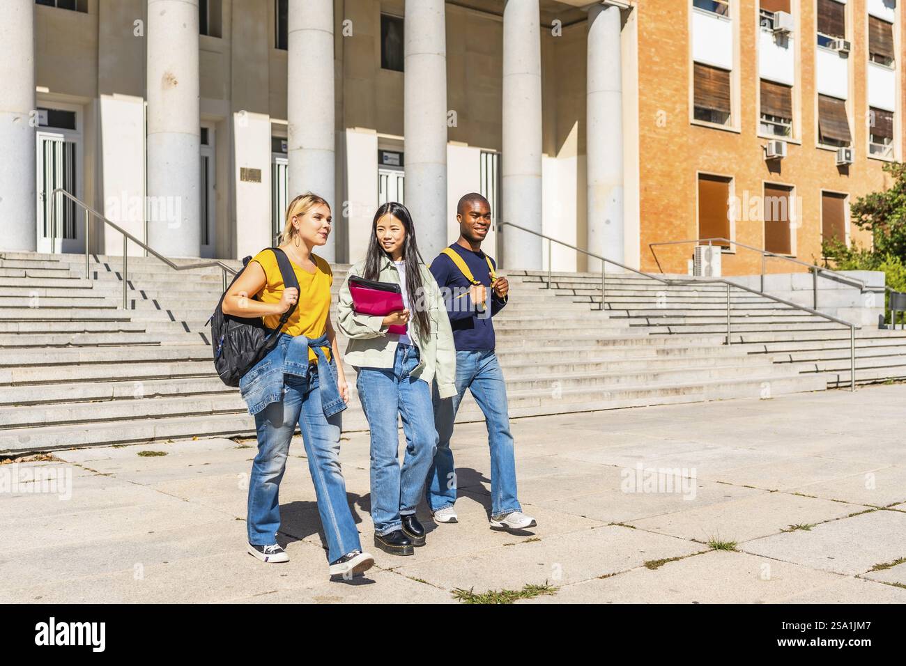 Horizontal full length photo with copy space of three university ...