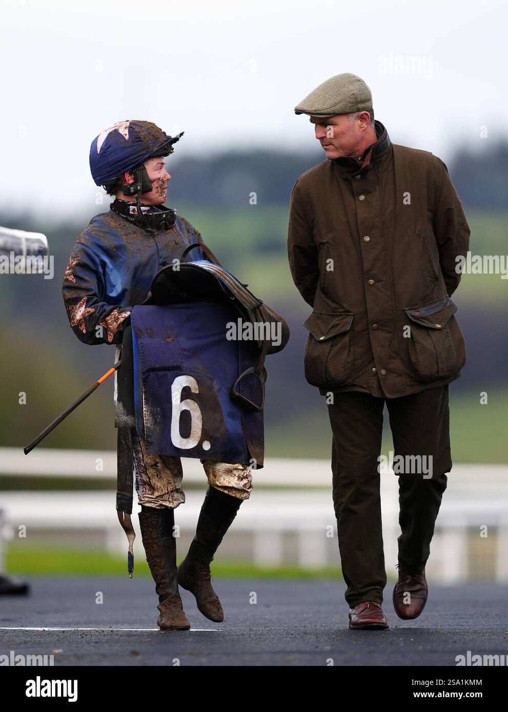 A muddy jockey Isabel Williams heads back in with trainer Evan Williams ...