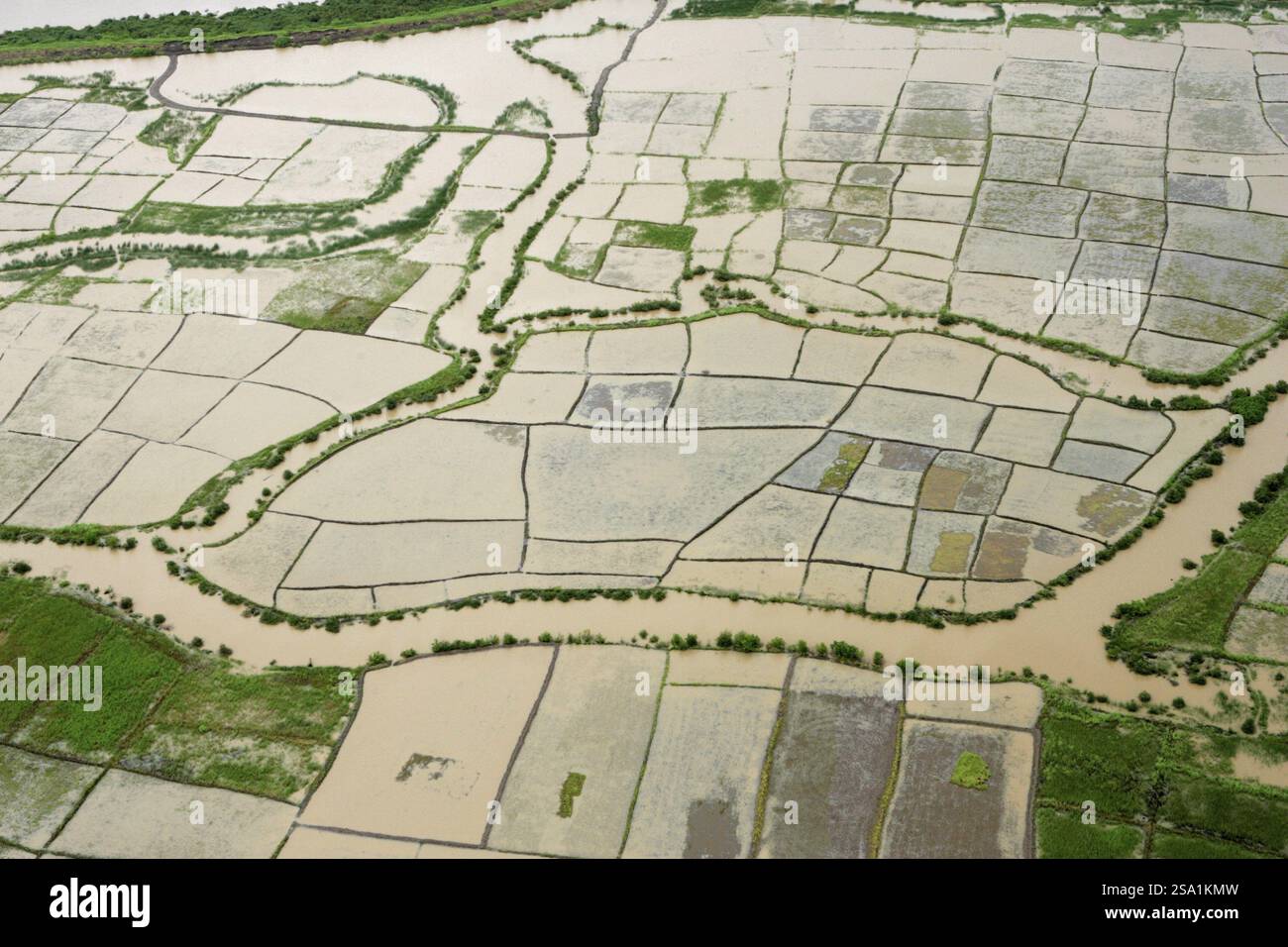 An aerial view of farming land immersed in water flood rocked in Raigad ...