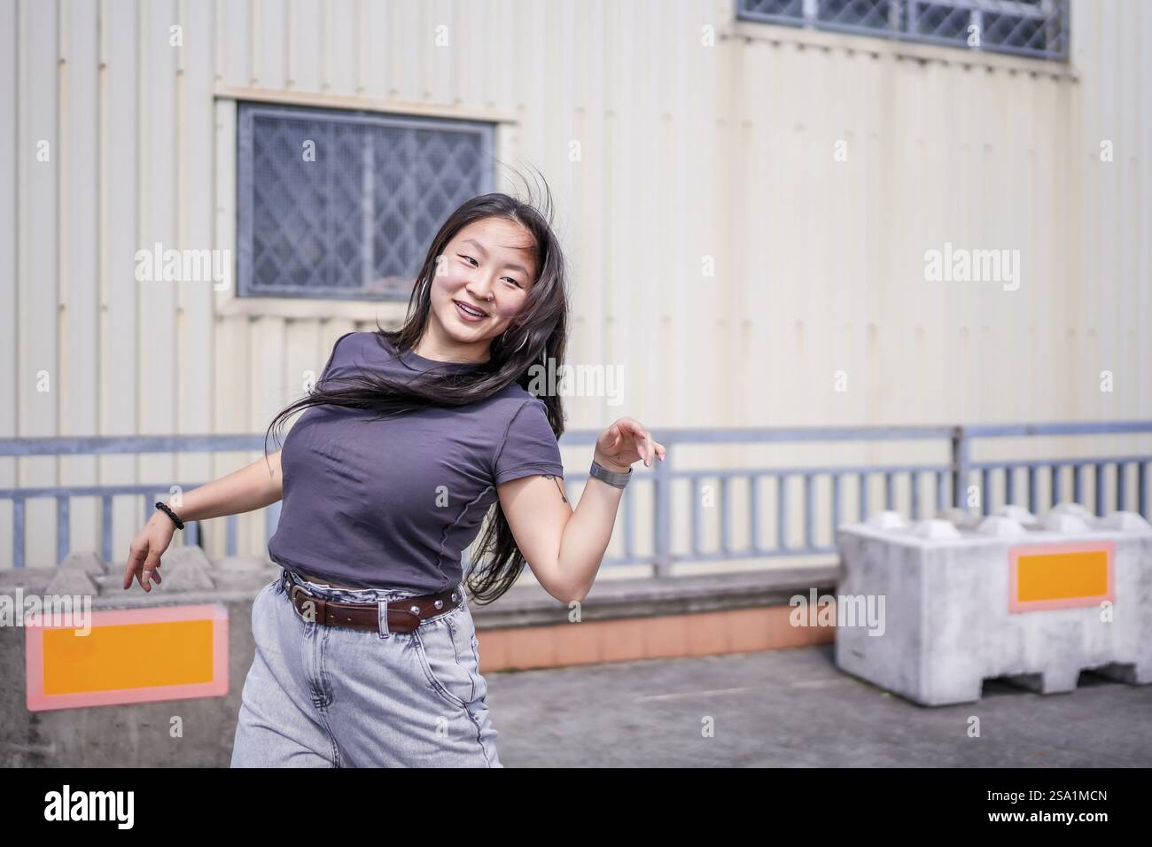 Enthusiastic female asian young dancer dancing k-pop in the city Stock ...