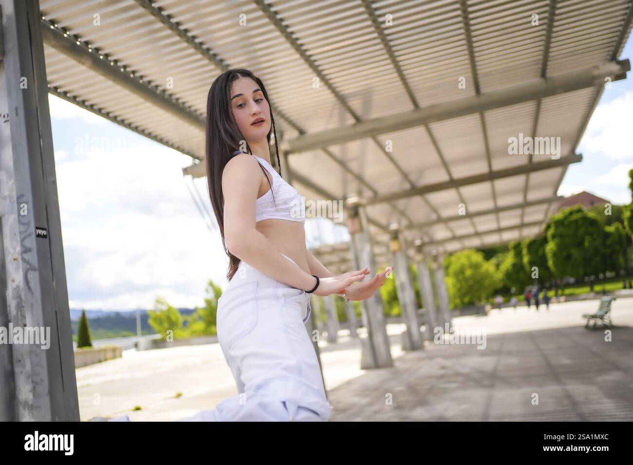 Side view with copy space of a caucasian young woman dancing freestyle ...