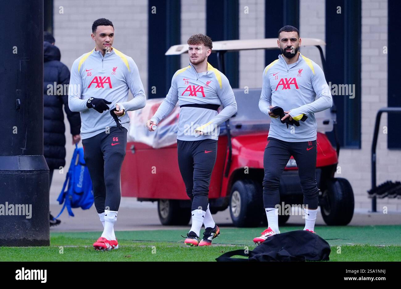 (left to right) Liverpool's Trent Alexander-Arnold, Harvey Elliott and ...