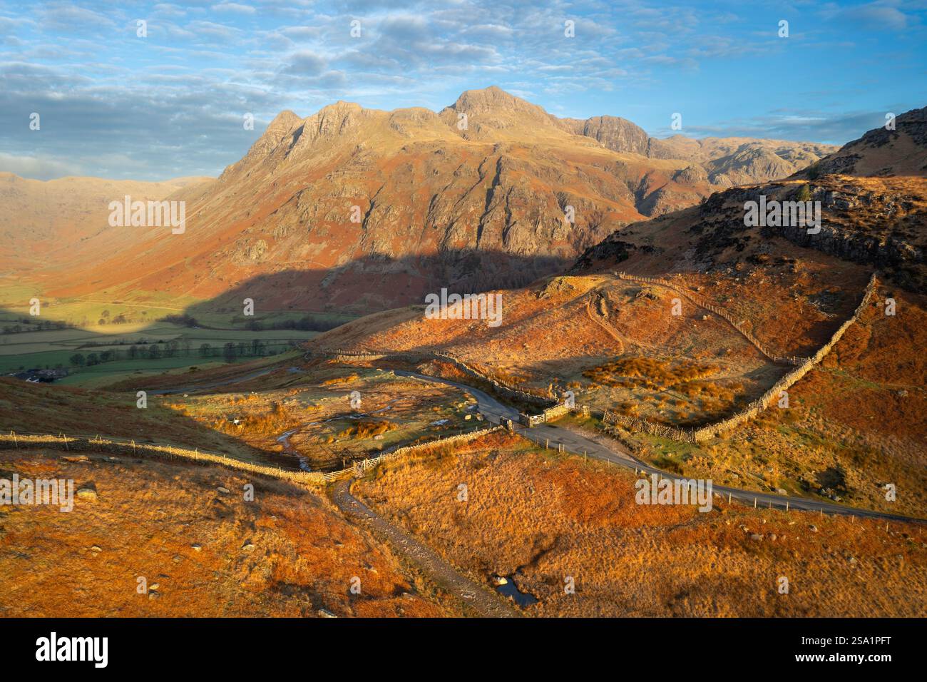 Aerial view of The Langdale Valley with Winter sunlight on mountains ...