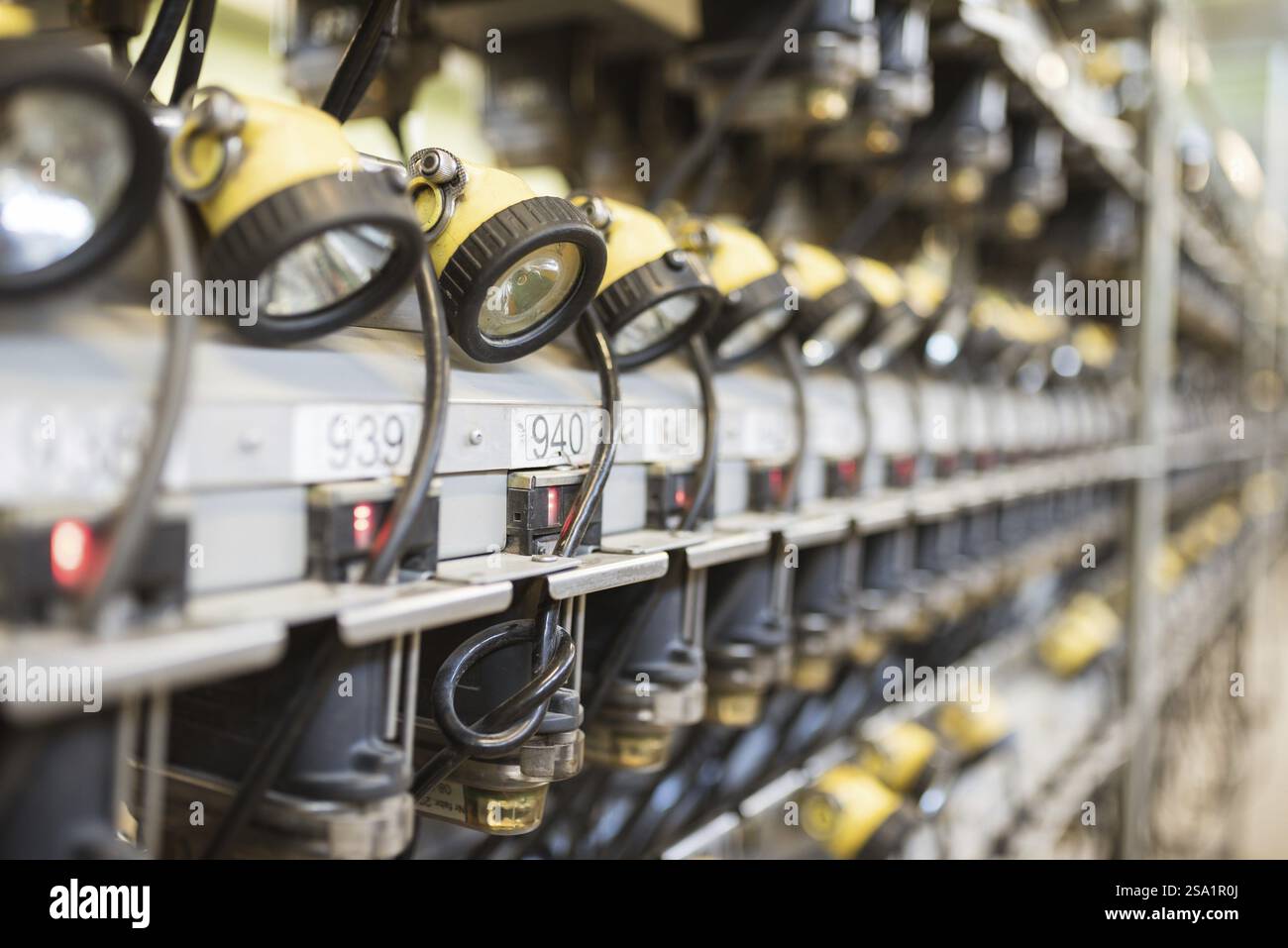 Mining head lamps on the shelves in the mine's lamp room Stock Photo ...