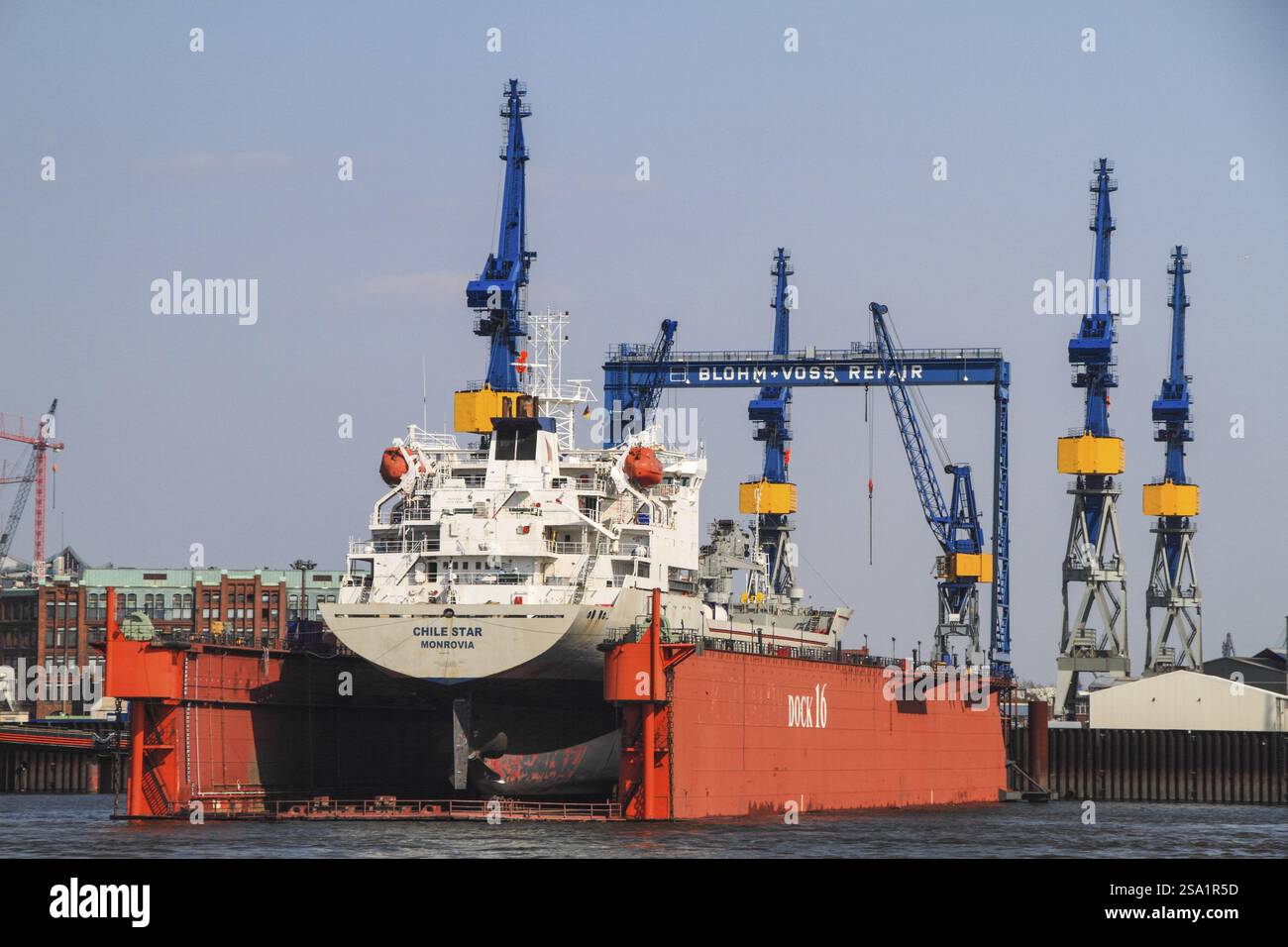 Dry dock Dock 16 of the Blohm + Voss Repair shipyard with cargo ship ...