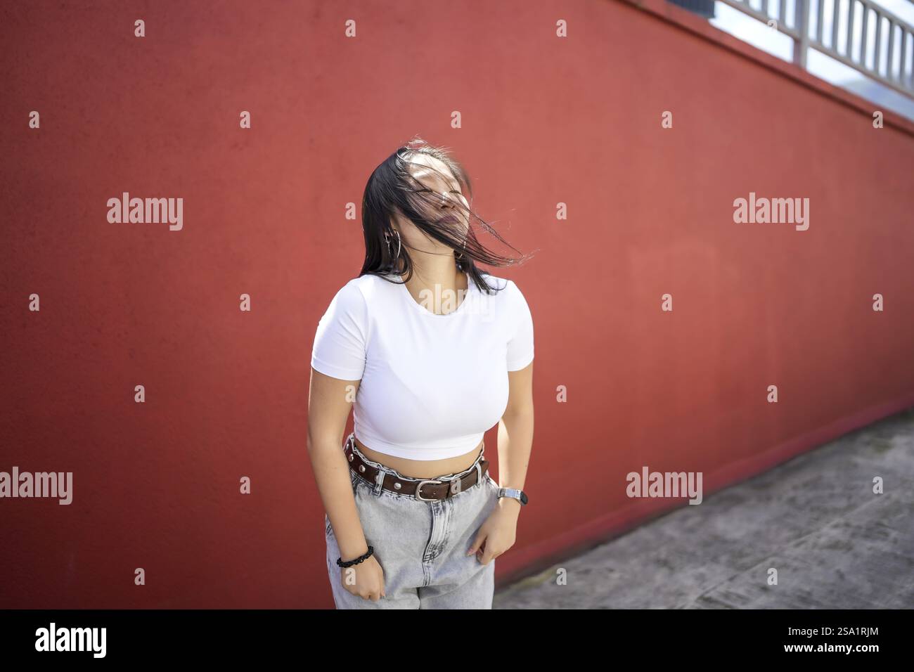 K-pop female young asian dancer performing in an urban space next to ...