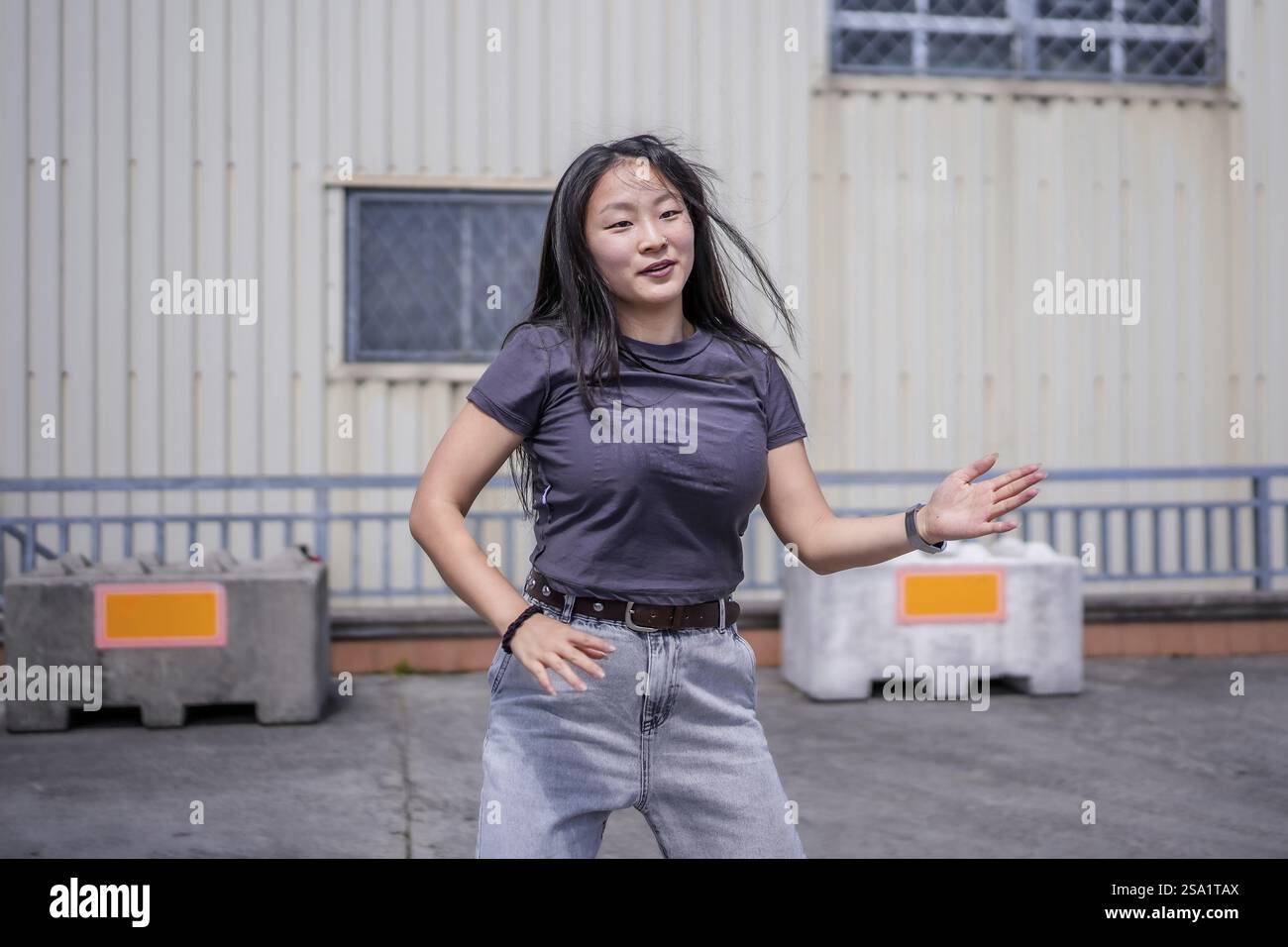 Female asian young artist dancing K-pop korean dance alone in the city ...