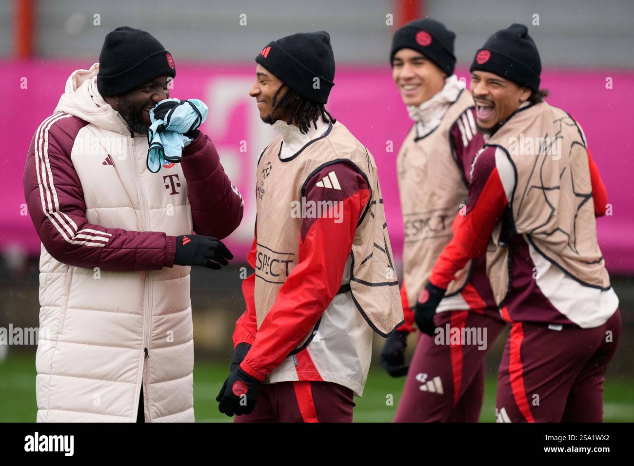 Bayern assistant coach Floribert N'Galula, left, jokes with Michael ...