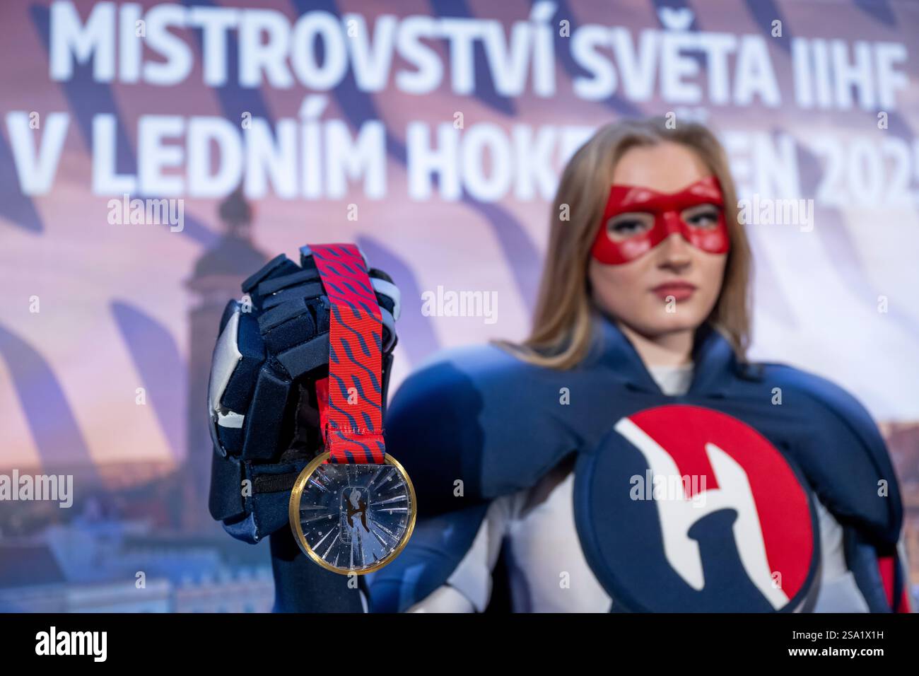 The mascot poses with a medal at the press conference for this year's ...